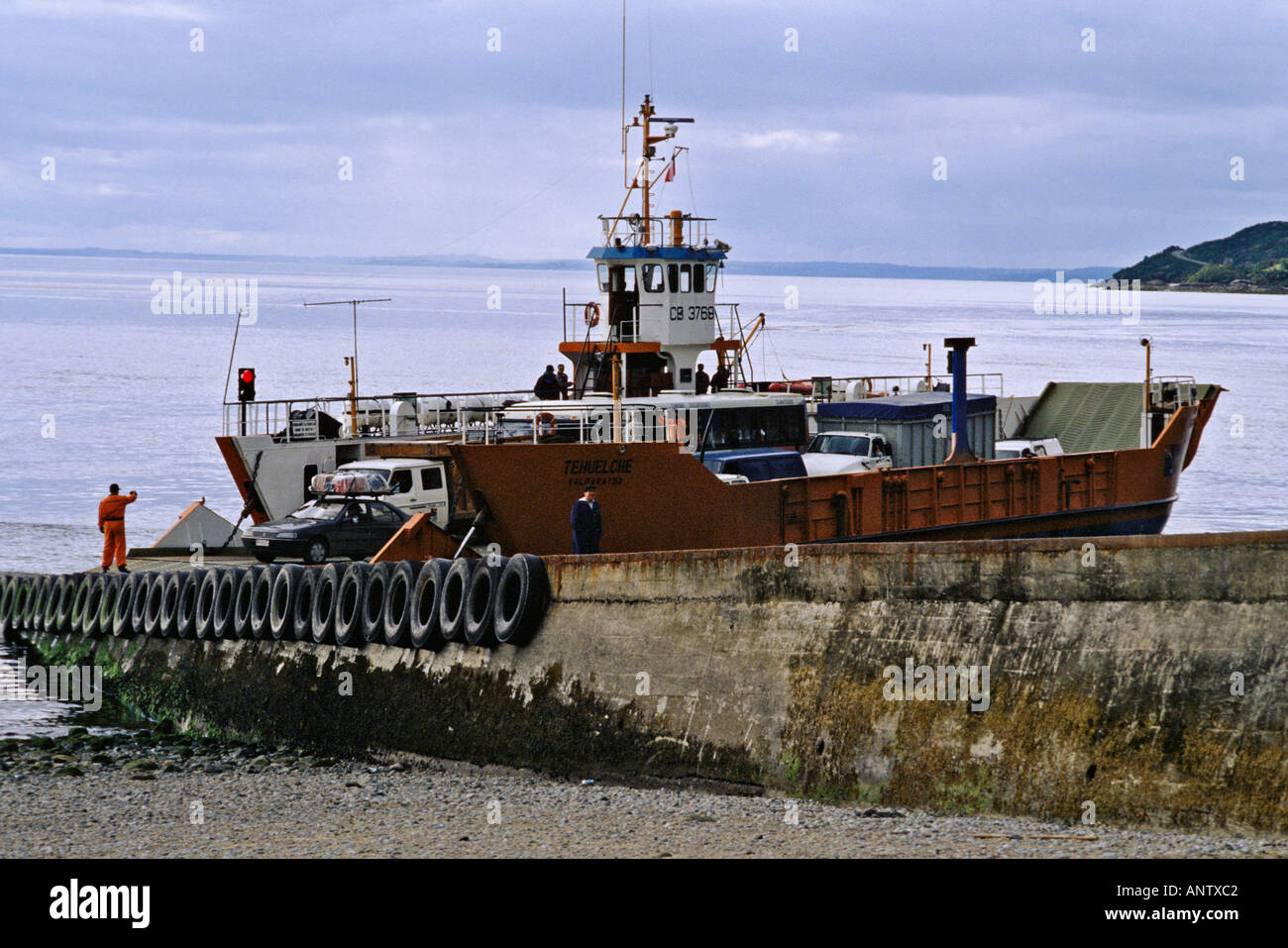 Ferry loading passengers on a concrete pier in Chaitén Patagonia Chile ...