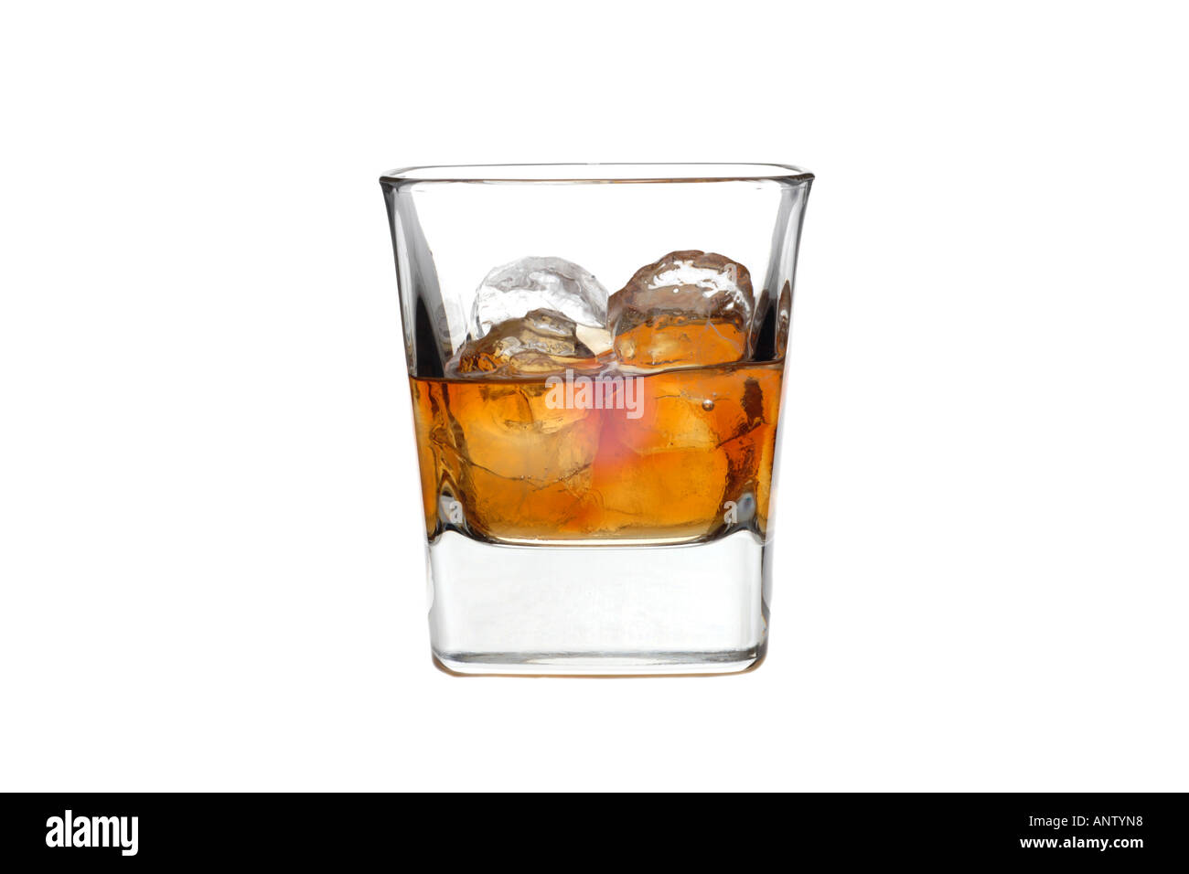 Scotch whisky with ice on white background Stock Photo - Alamy