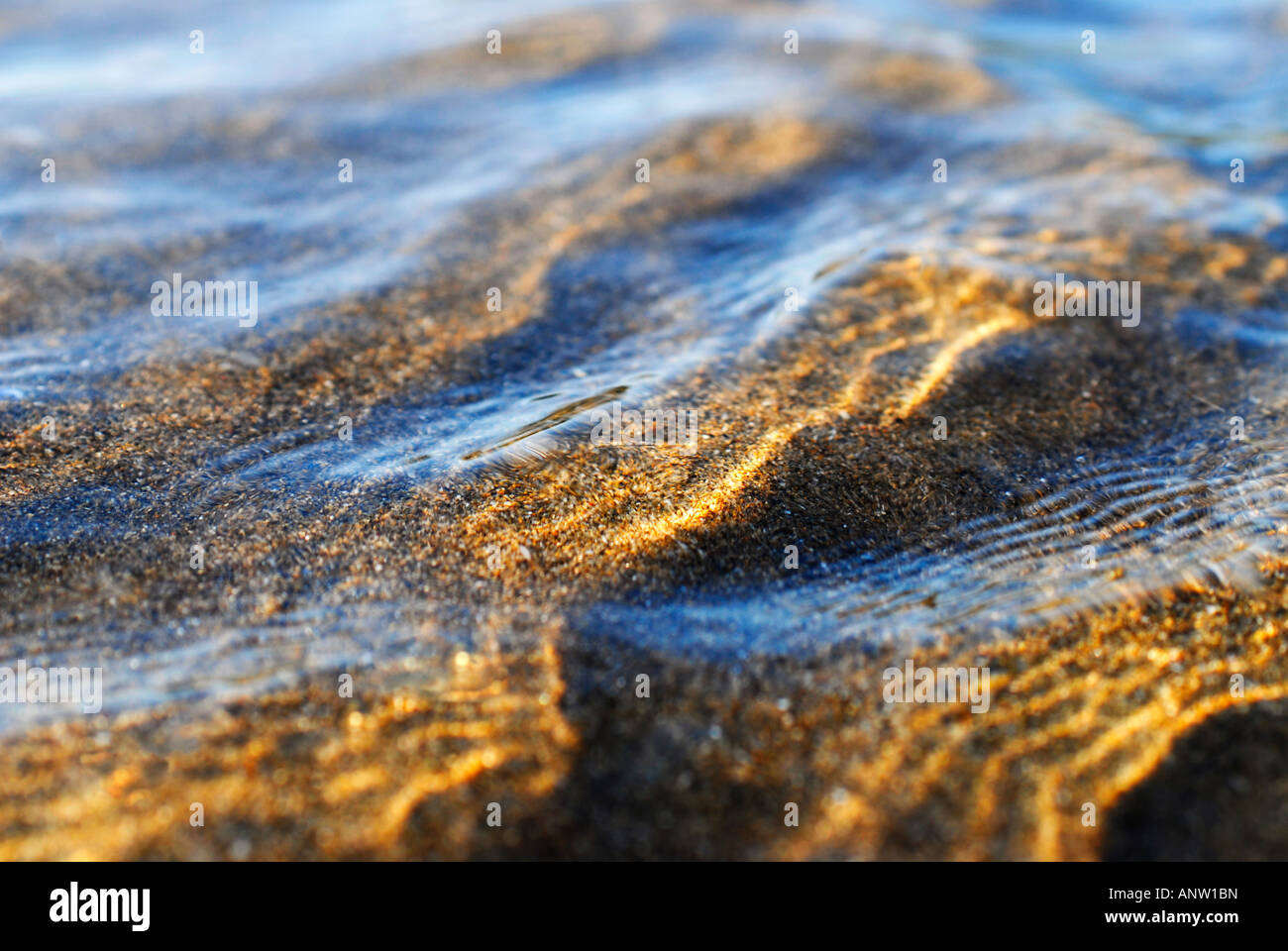 Ripples on calm shallow sea water surface Stock Photo - Alamy
