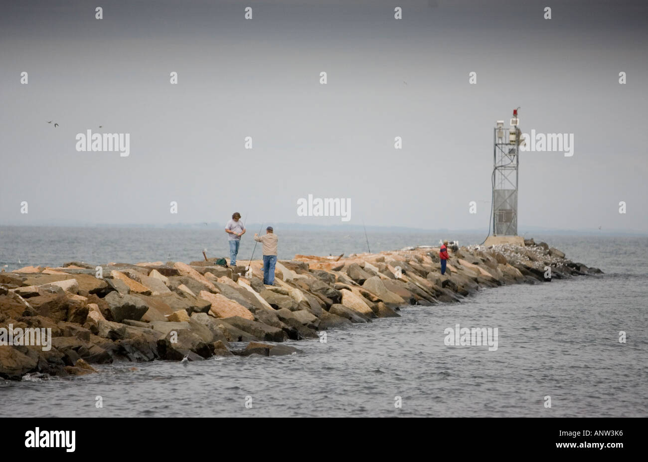 Fishing from a jetty on Long Island, NY Stock Photo - Alamy