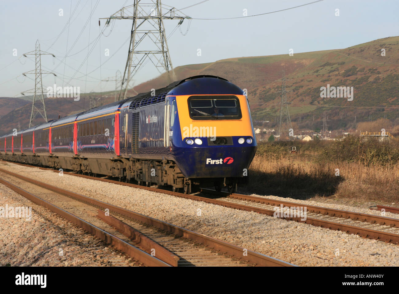 London Train passing Margam Steelworks Stock Photo - Alamy