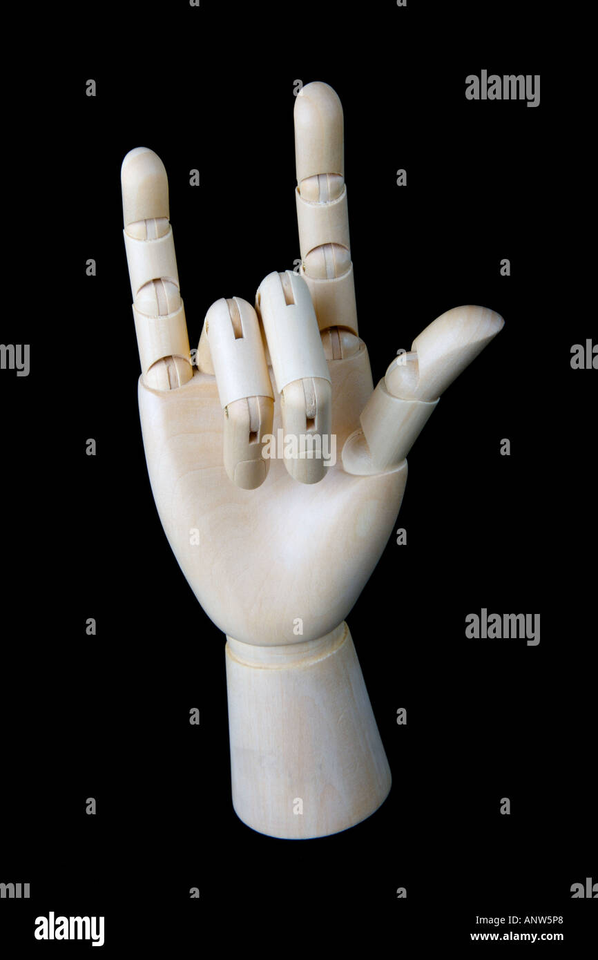 A wooden artists modelling hand showing the surfing gesture for shaka ...