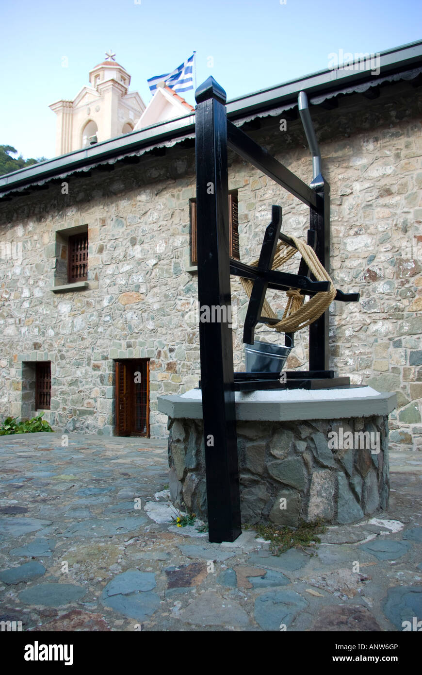 Bucket on rope above well Stock Photo - Alamy