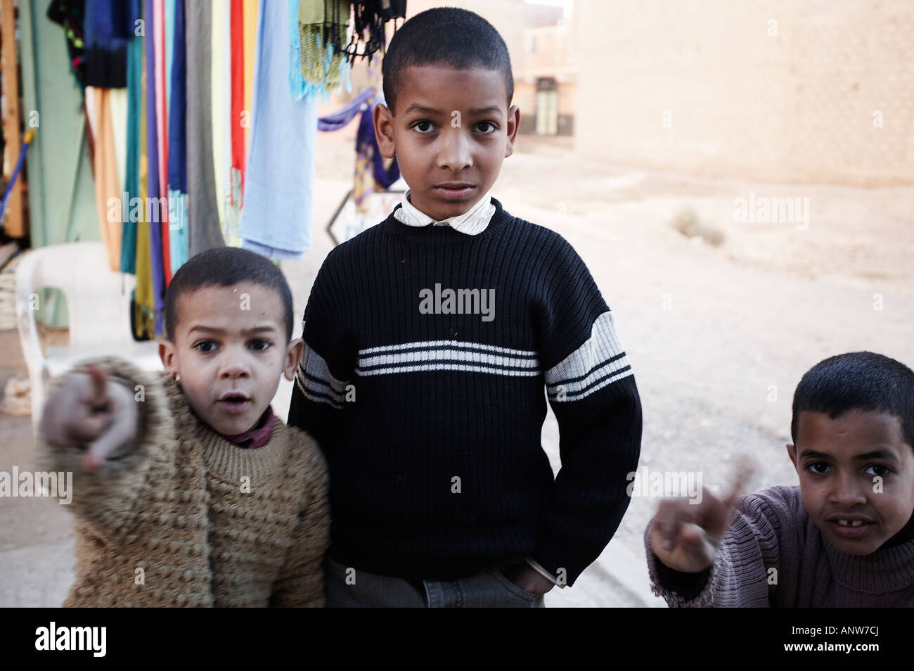 3 Moroccan boys shout at the camera Stock Photo - Alamy