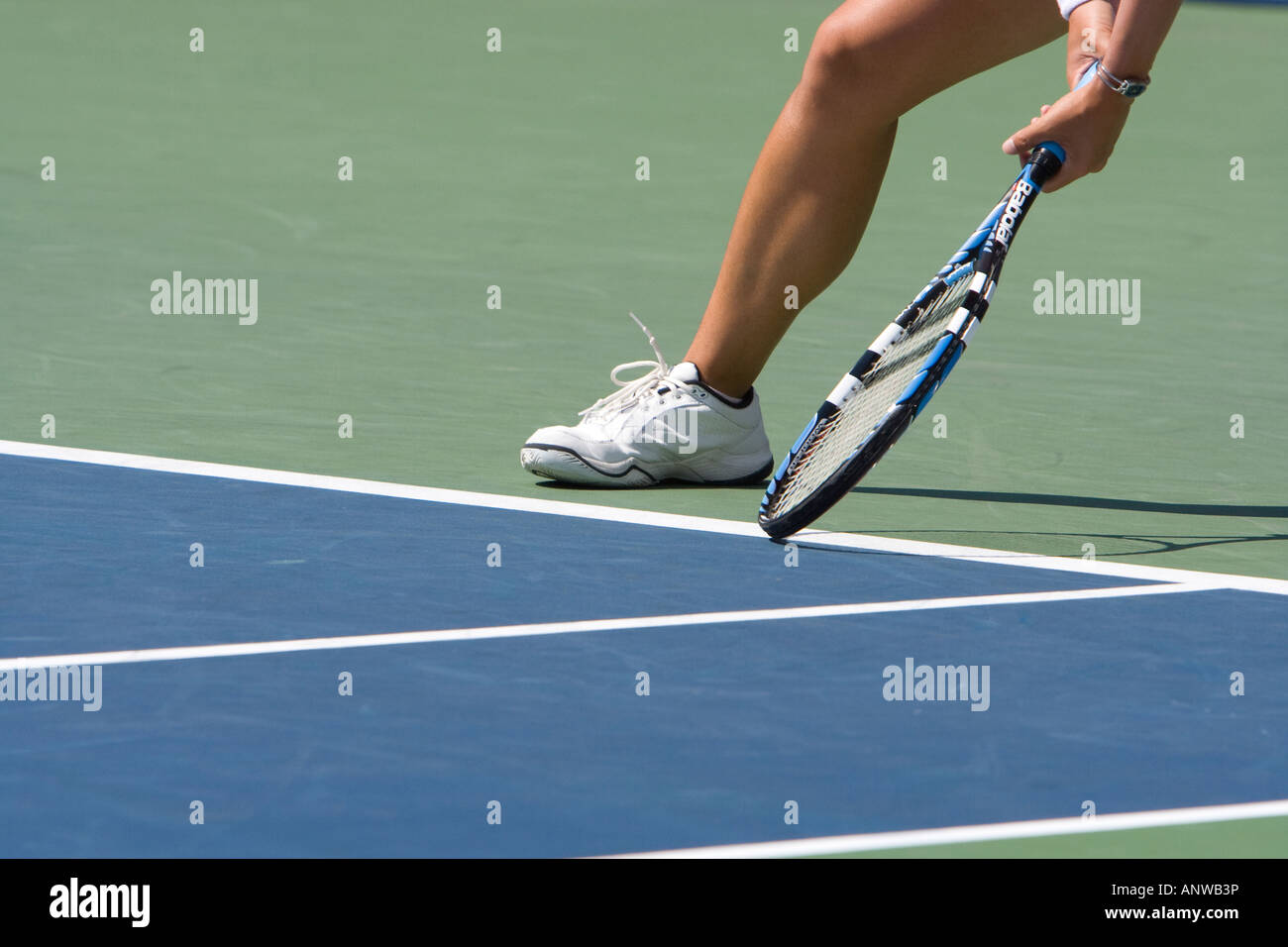 A female tennis player gets ready to receive a serve Stock Photo - Alamy