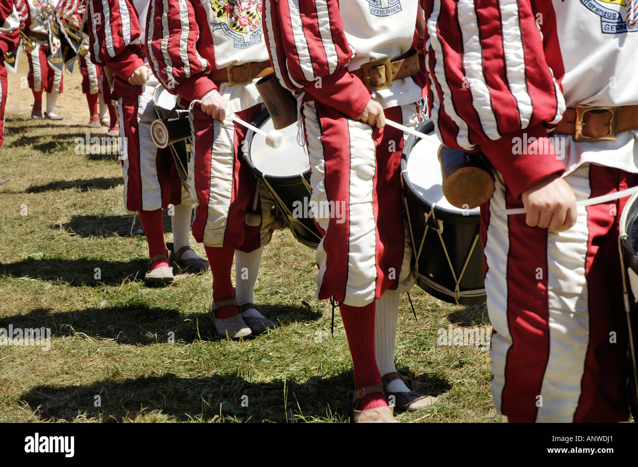 Drums drummers with red white clothes march lock-steps, knight festival ...