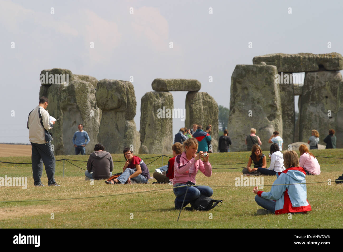 Stonehenge tourists visiting the famous ancient standing stone circle ...
