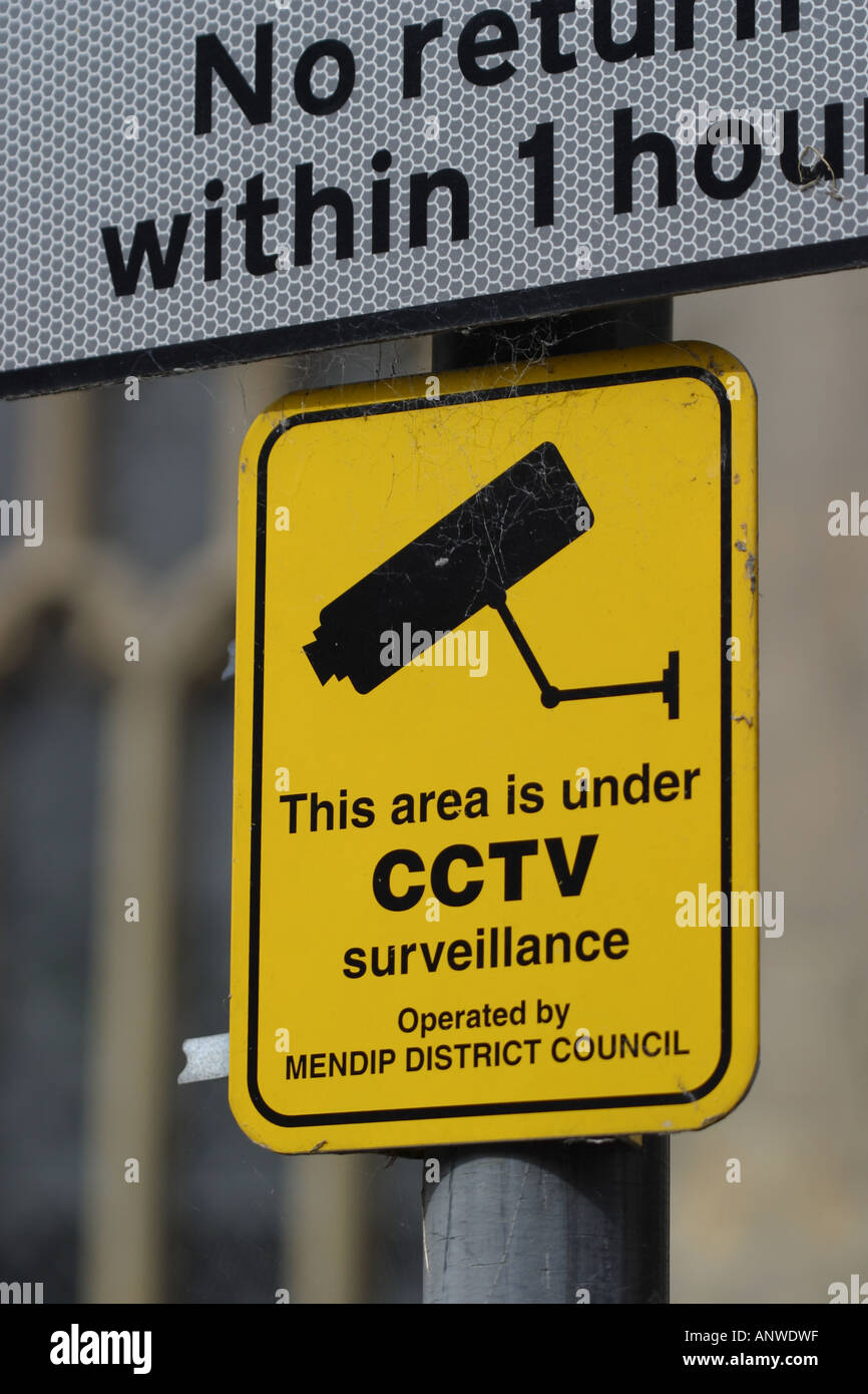 CCTV camera surveillance warning sign in town centre Stock Photo - Alamy