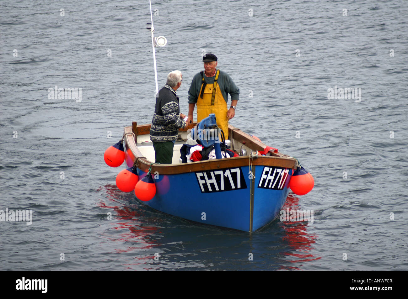 Two Men Fishing Cornwall Stock Photo - Alamy