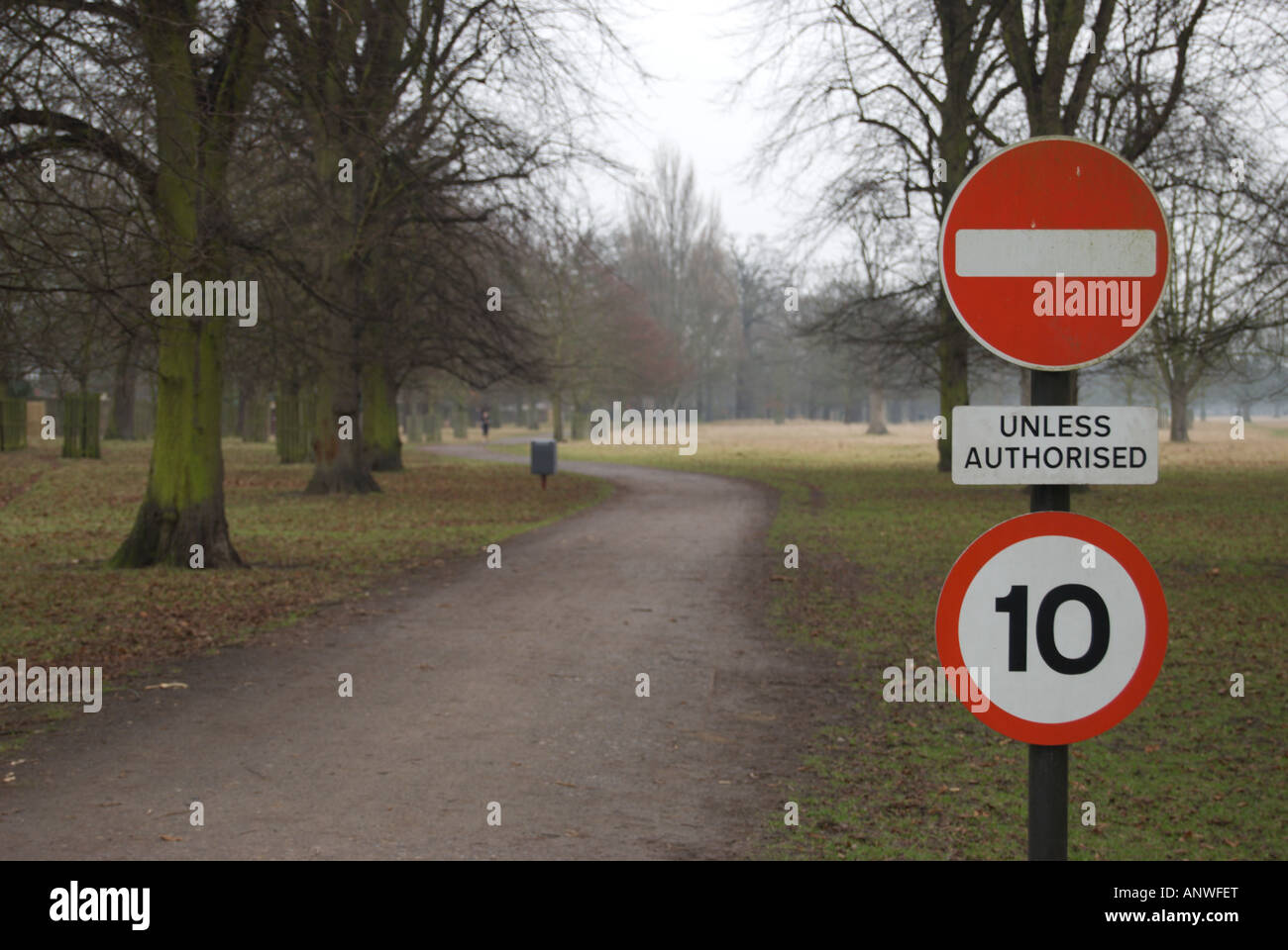 a british no entry sign, a speed limit sign, and a notice restricting ...