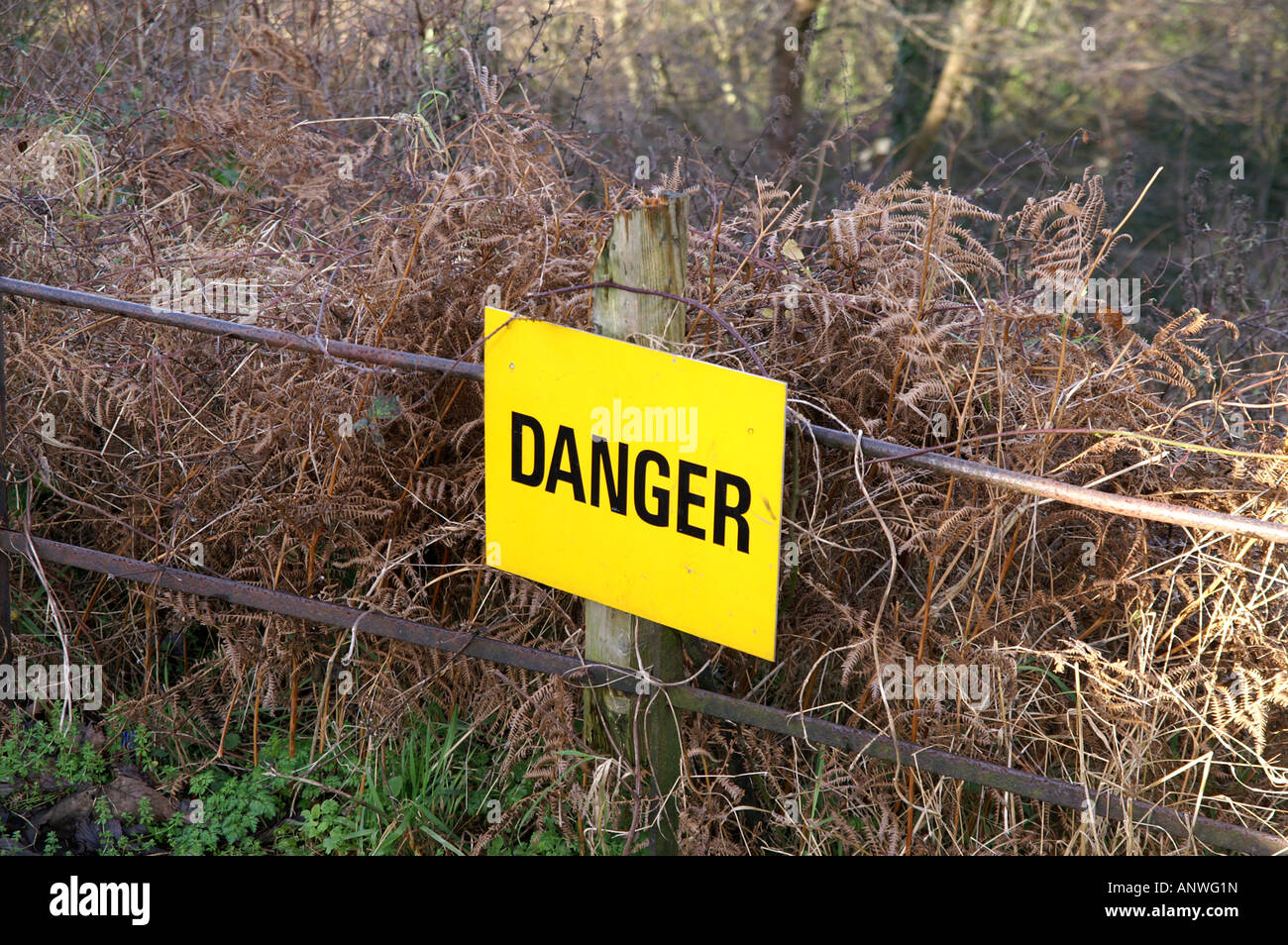 Warning Sign on Iron Railings Stock Photo - Alamy