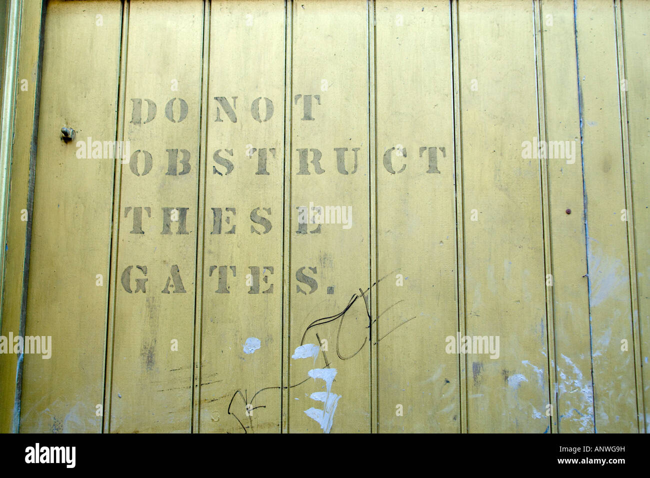 Stencilled notice on garage doors Do Not Obstruct These Gates Stock ...