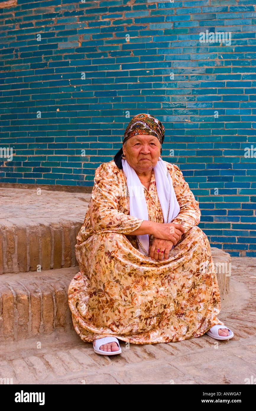 Uzbek lady having a rest along the streets of Old Khiva Uzbekistan ...
