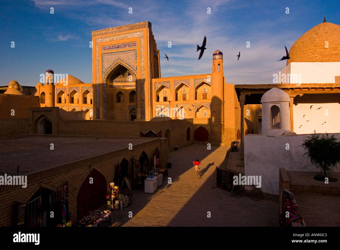 Along the streets of old Khiva at sunset Khiva Uzbekistan Stock Photo ...