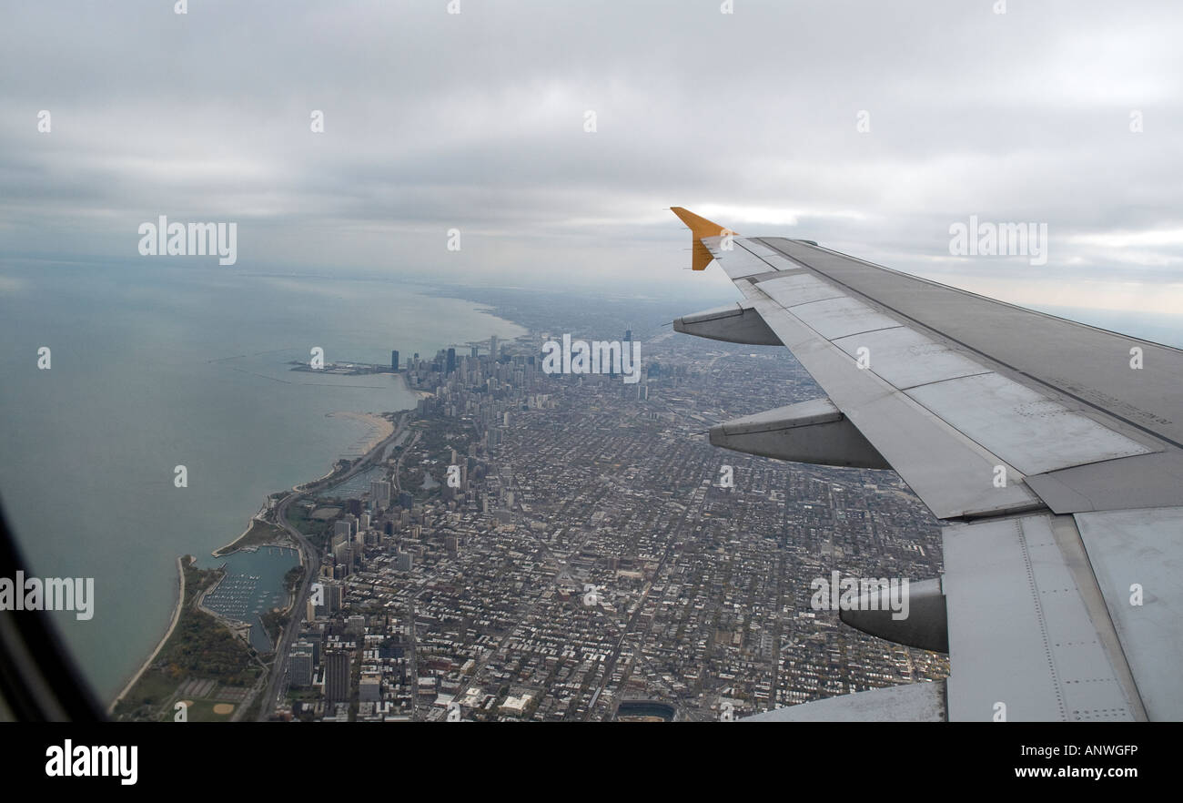 commercial flight comes in for a landing over Chicago Illinois and Lake ...