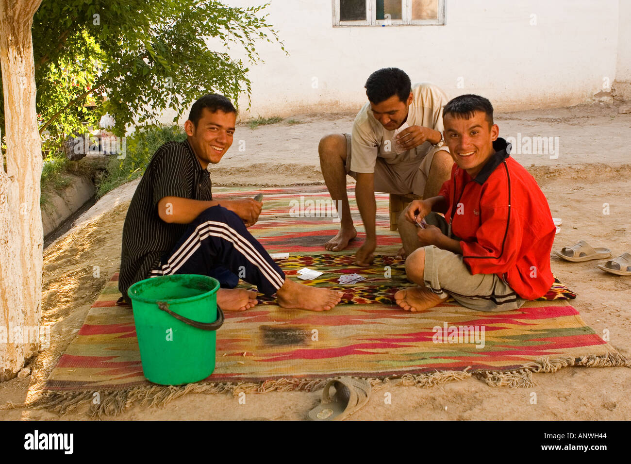 Yong Uzbek men along the streets of old Khiva Uzbekistan Stock Photo ...