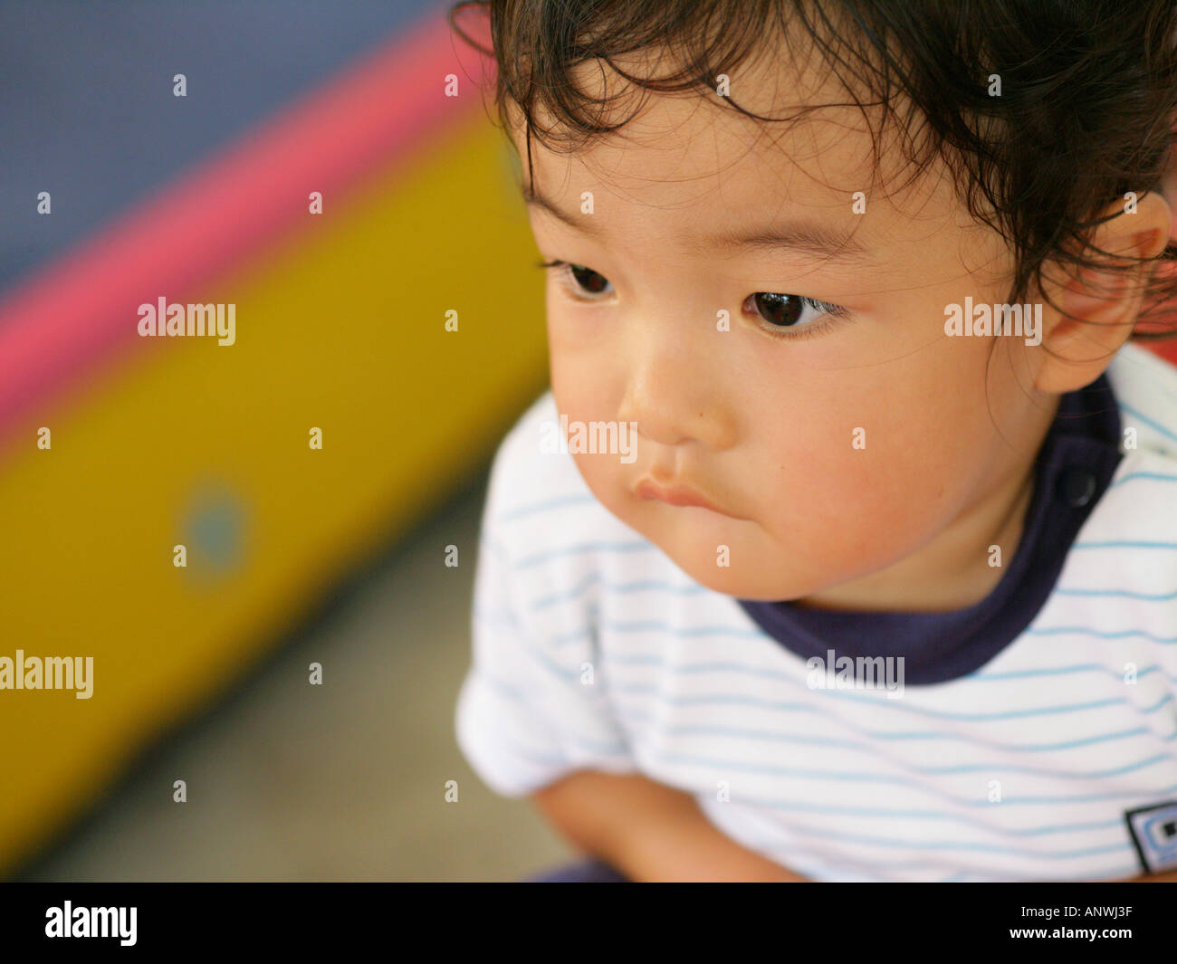 Side profile of a boy sitting Stock Photo - Alamy