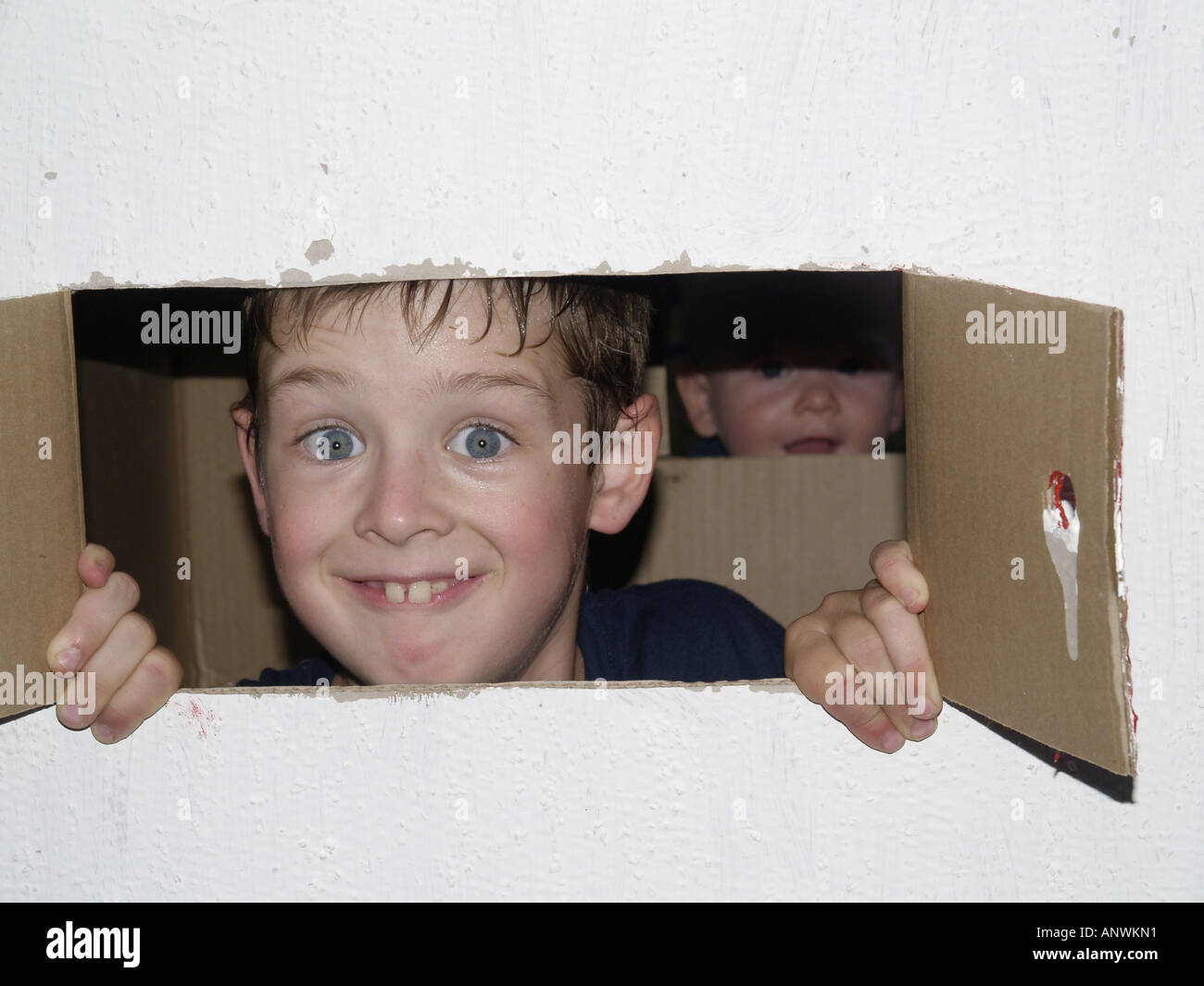 Boy playing in a box hi-res stock photography and images - Alamy