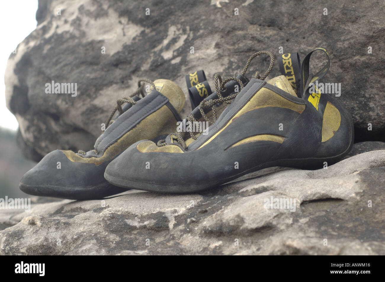 Rock climbing shoes sitting on sandstone rock Stock Photo - Alamy