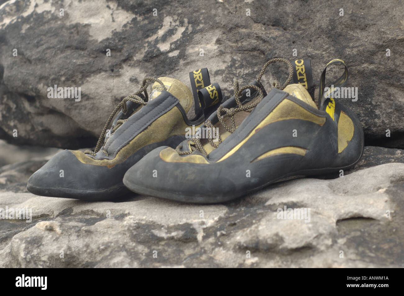 Rock climbing shoes sitting on sandstone rock Stock Photo - Alamy