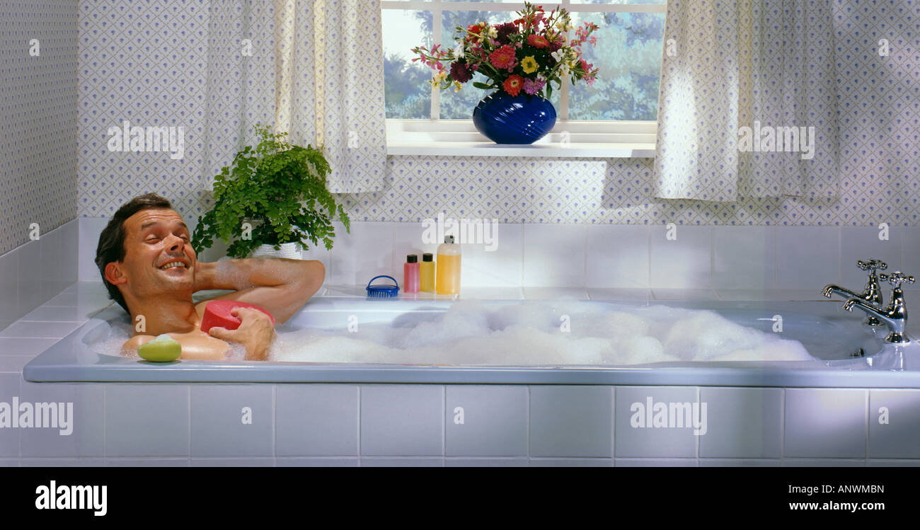 Man taking luxury bath Stock Photo - Alamy