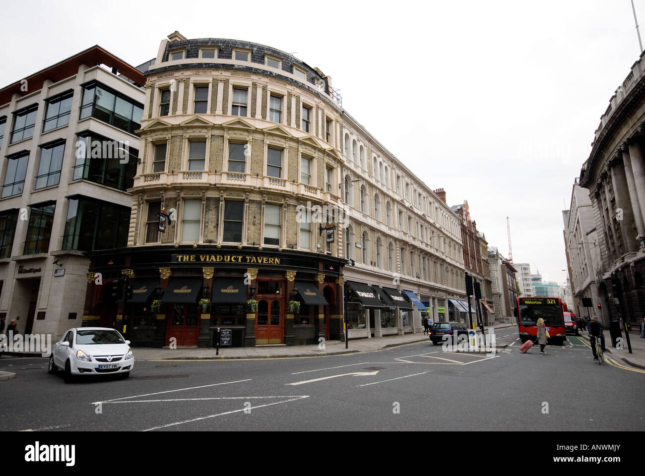 the viaduct tavern near st paul, street with white car and red bus ...