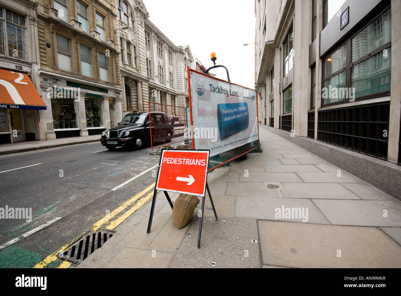 pedestrian work in progress, red sign with arrow, London Stock Photo ...