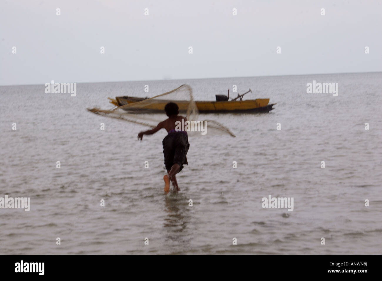 fisherman fishing out at sea Stock Photo - Alamy