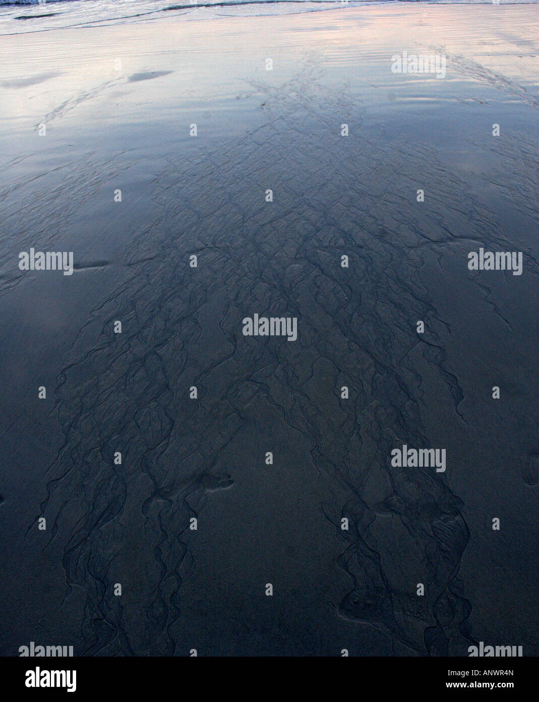 patterns on the beach made by the waves Stock Photo - Alamy
