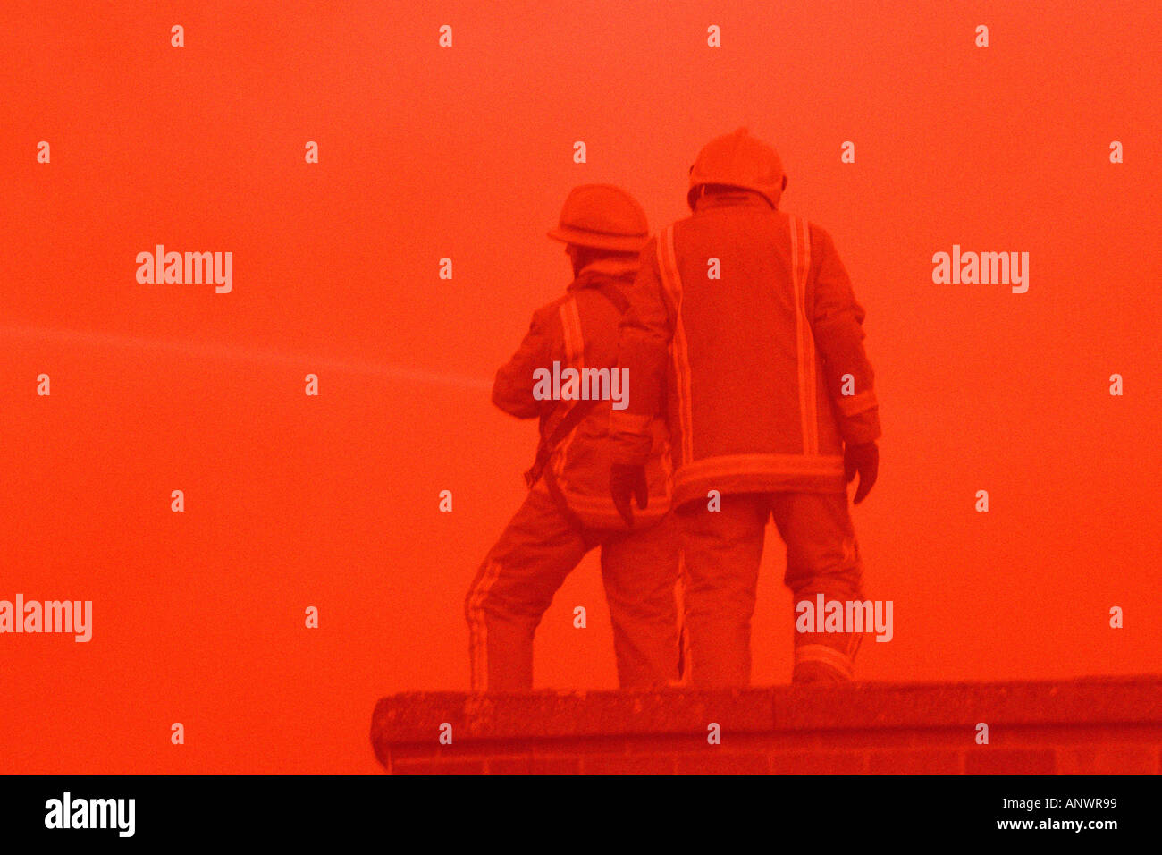 Firemen fighting fire abstract concept Stock Photo - Alamy