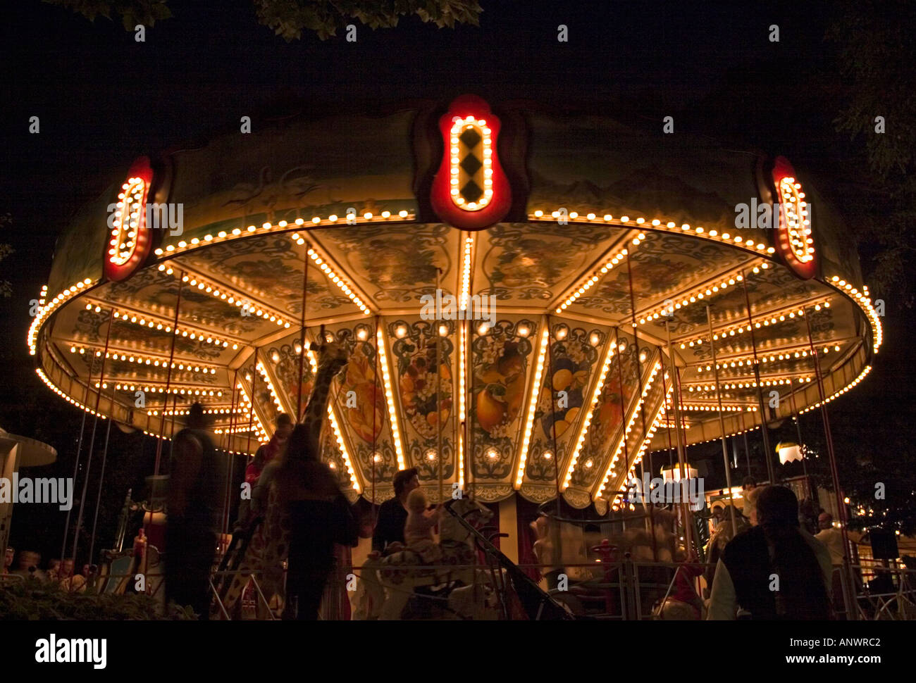 Carousel at night Tivoli Gardens Copenhagen Denmark Stock Photo - Alamy