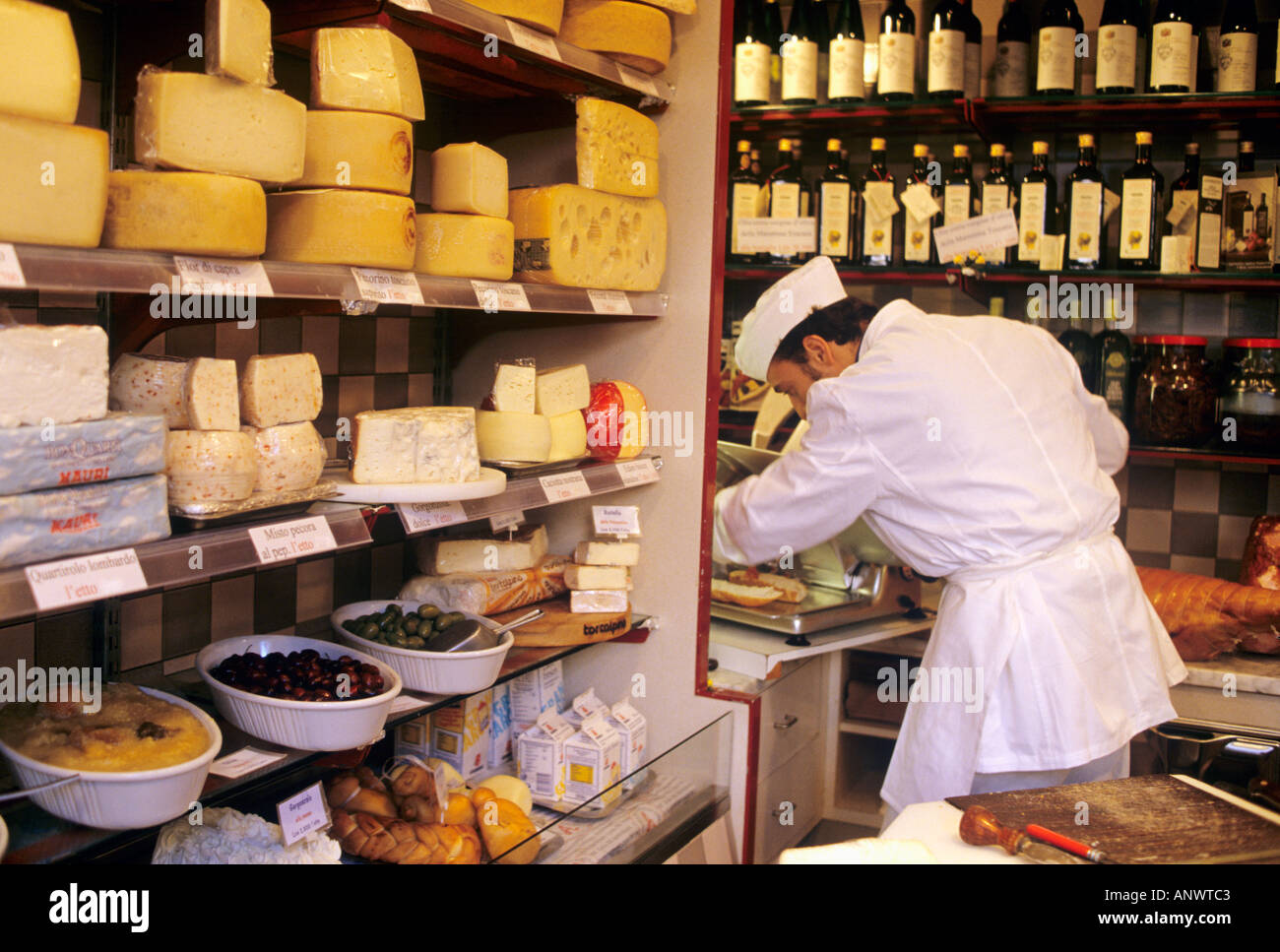 Italian deli delicatessen interior Tuscany shopkeeper owner with ...