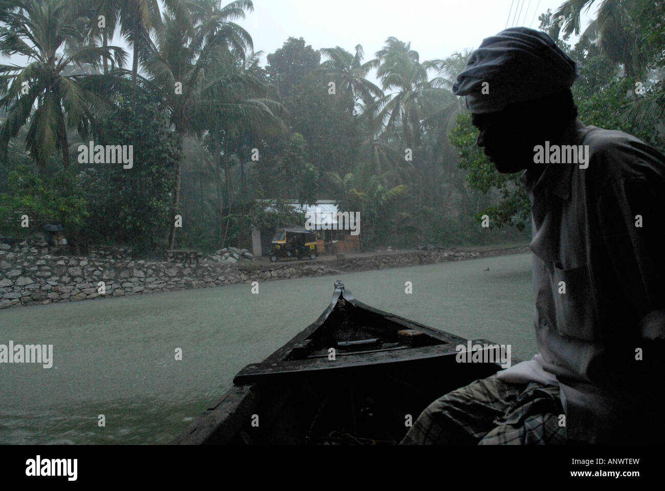 pouring rain in the backwaters of kerala,auto in the background and ...