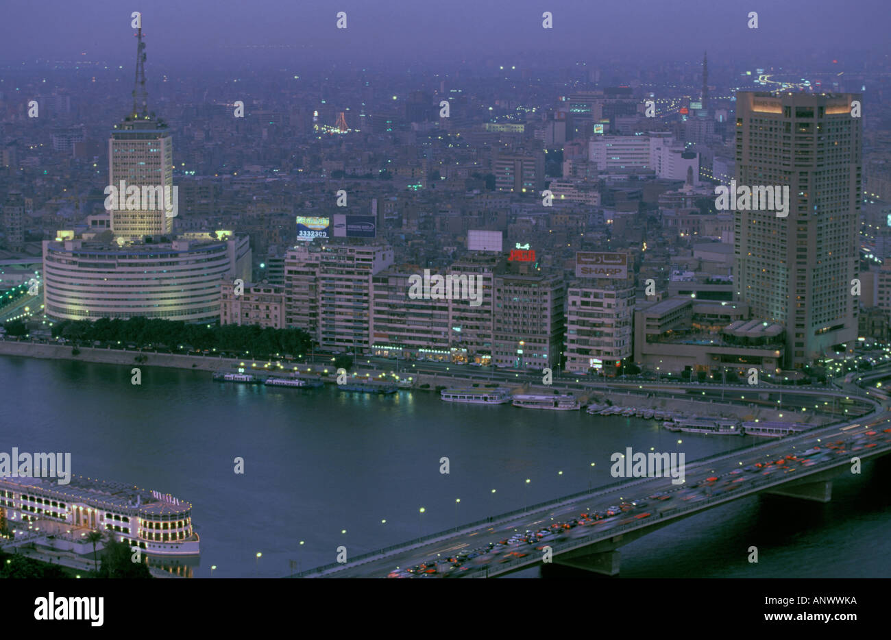 Africa, Egypt, Cairo. View of Corniche el Nil and 6th of October Bridge ...
