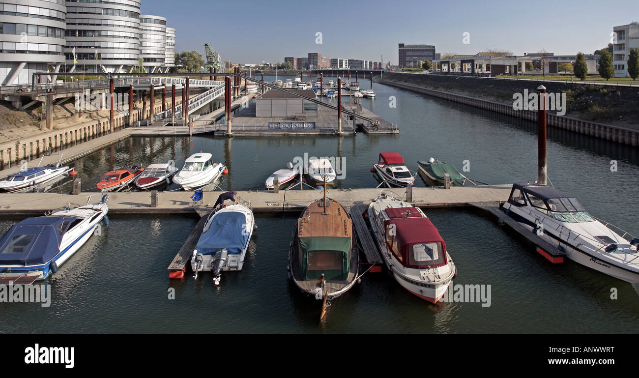 pedestrian bridge with the marina and the five boats in the inner ...