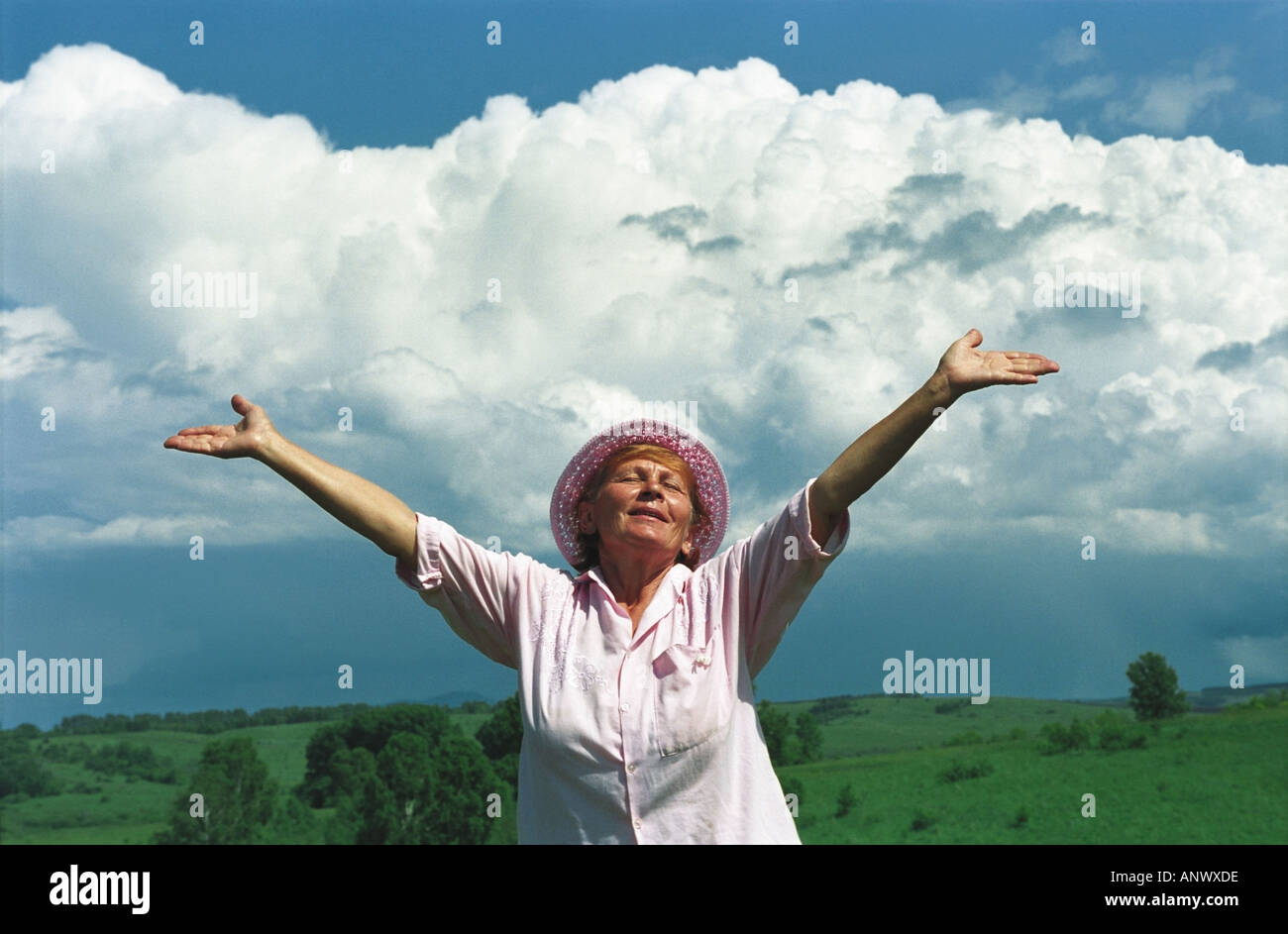 Female hands lifted blue hi-res stock photography and images - Alamy