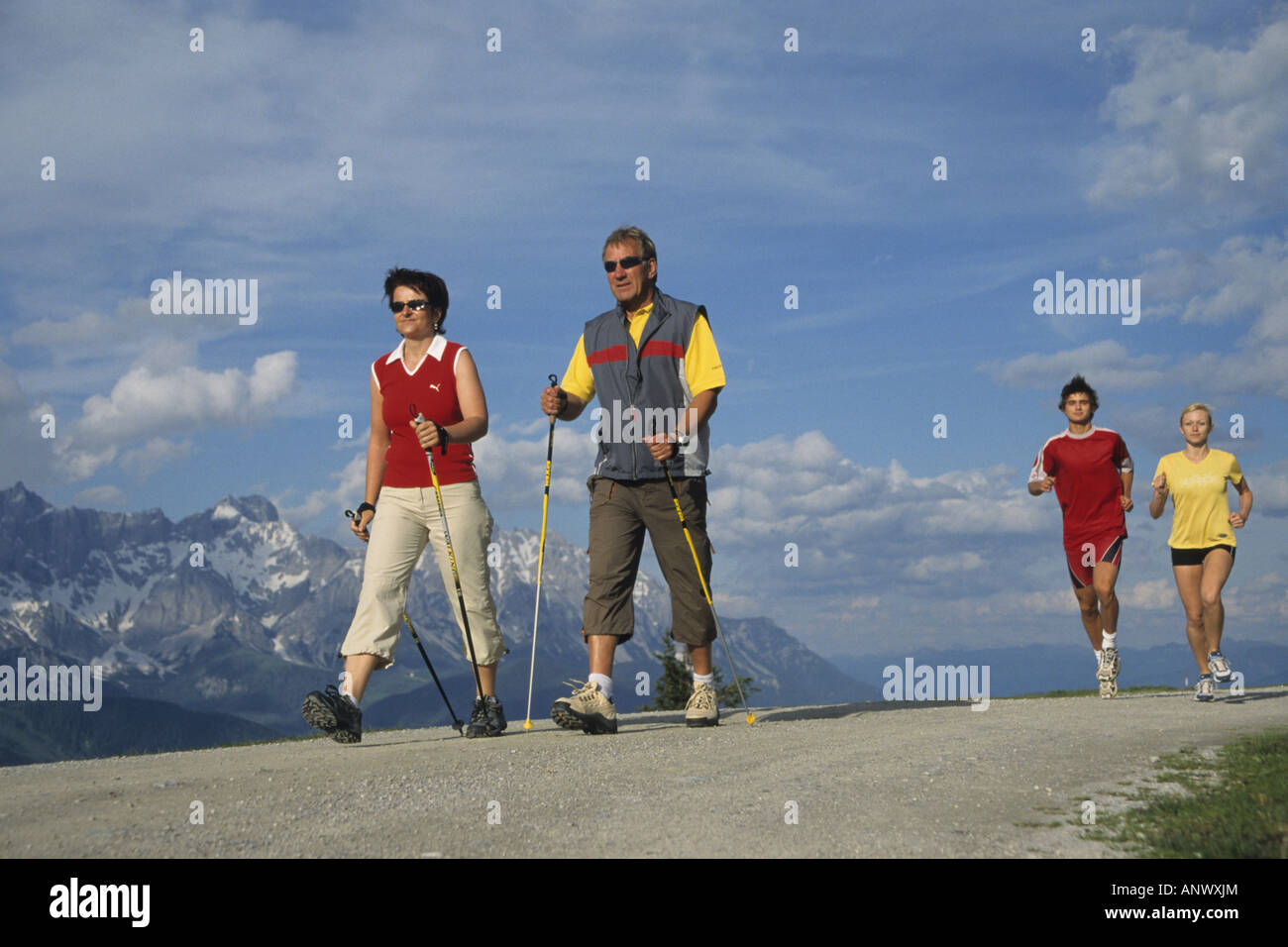 Nordic Walking and jogging in the Alps, Alps Stock Photo - Alamy