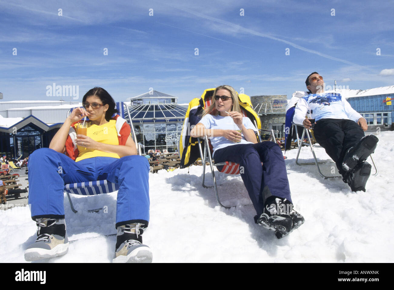 Three friends chill out and sunbathing at a mountain station Stock ...