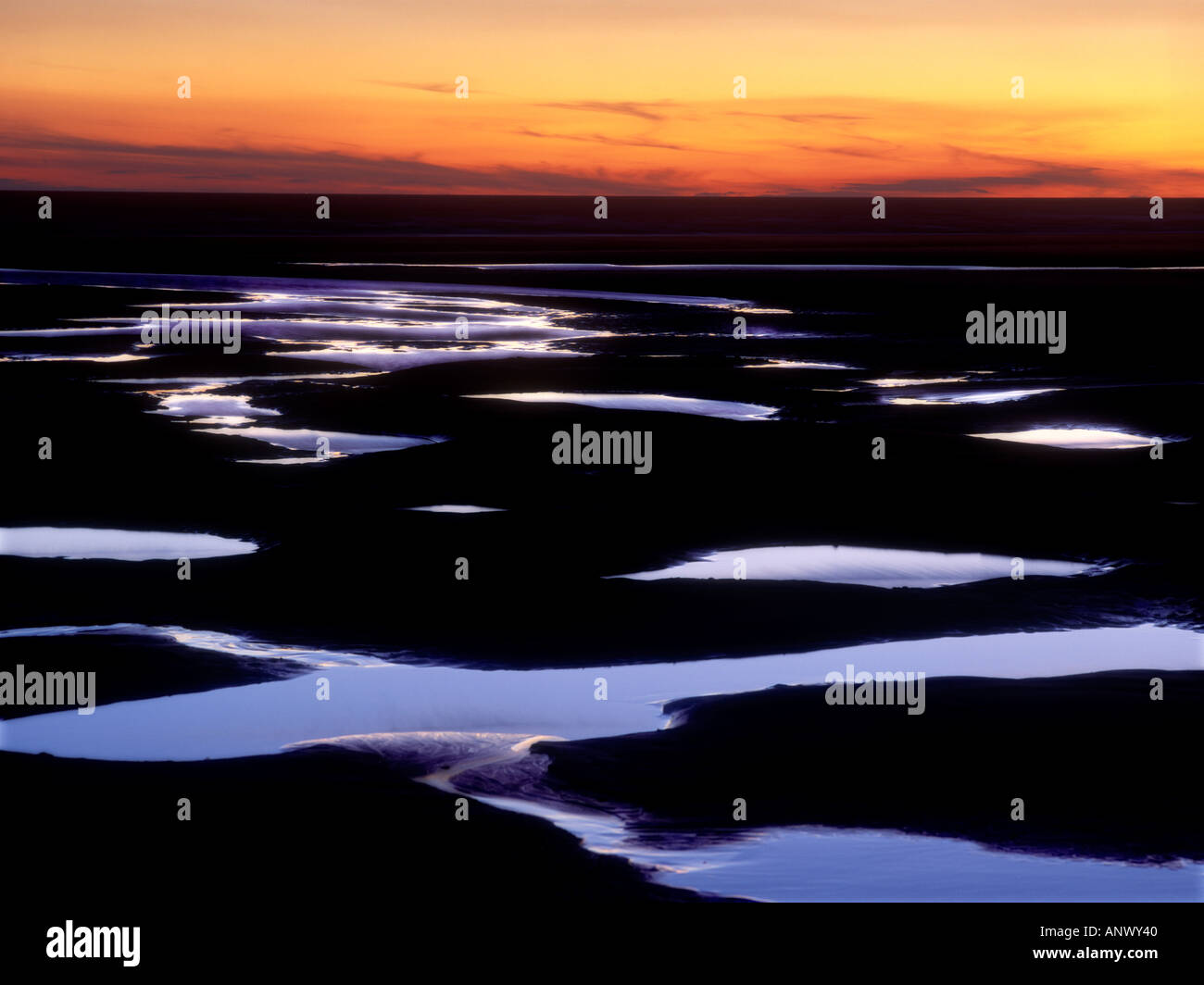 sea water in pools puddles on beach at low tide dusk evening night ...