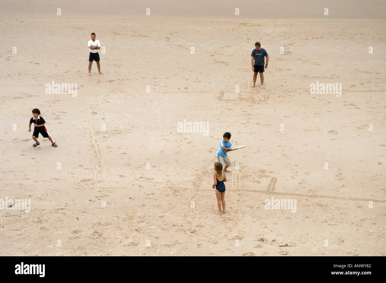 Family cricket on the beach Stock Photo - Alamy