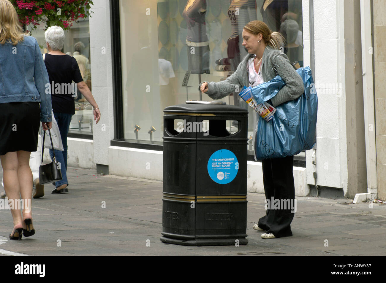 Woman dropping bin hi-res stock photography and images - Alamy
