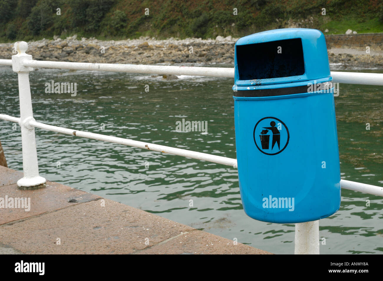 Blue Litter bin on the harbour rail at Rozel Bay in north Jersey Stock ...