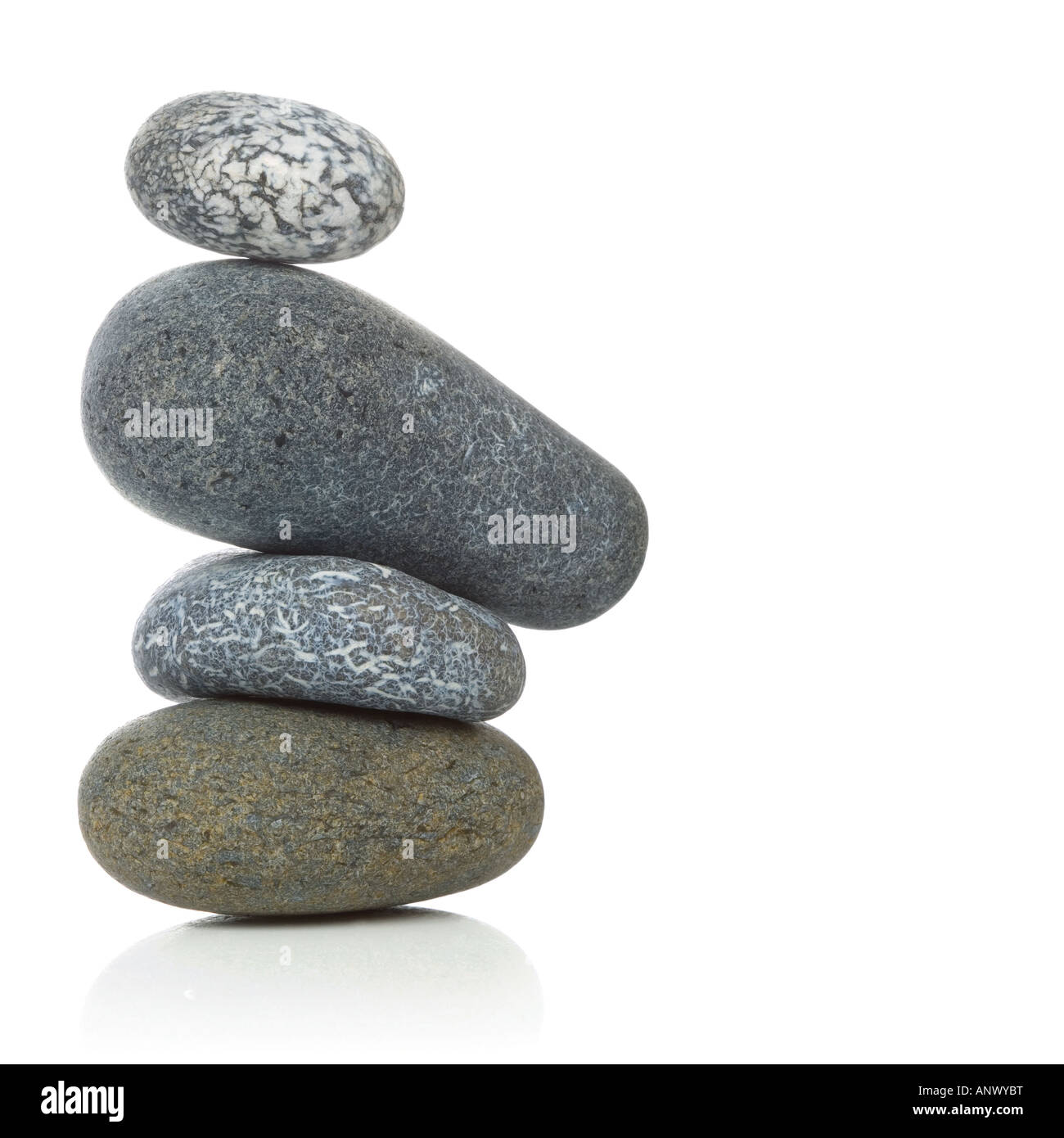 Four pebble sculpture isolated on a white background Stock Photo - Alamy