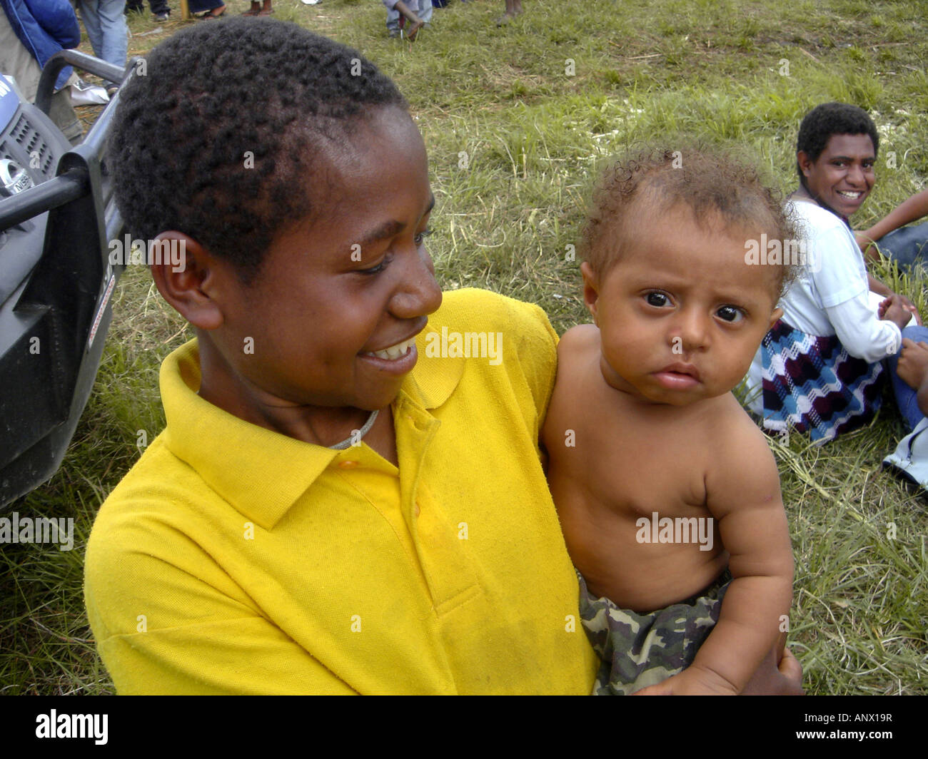 Boy with a child, Papua New Guinea Stock Photo - Alamy