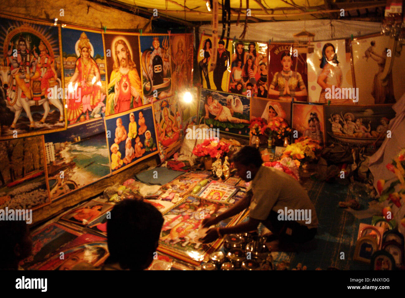 indian shop with pictures of gods and actors Stock Photo - Alamy