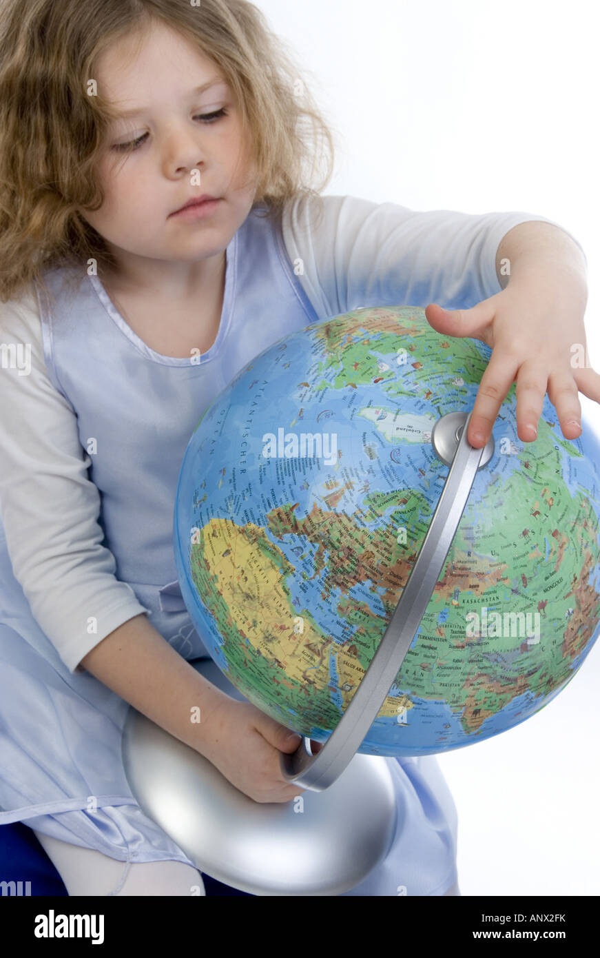 girl exploring globe Stock Photo - Alamy