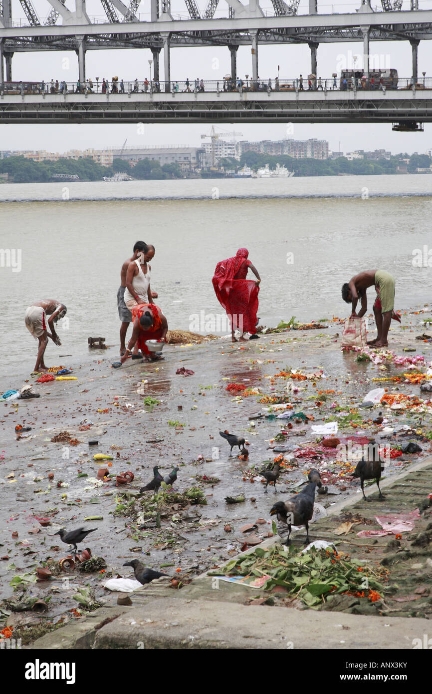 shore scenery at the Hooghly-River, with the Howrah Bridge in the ...