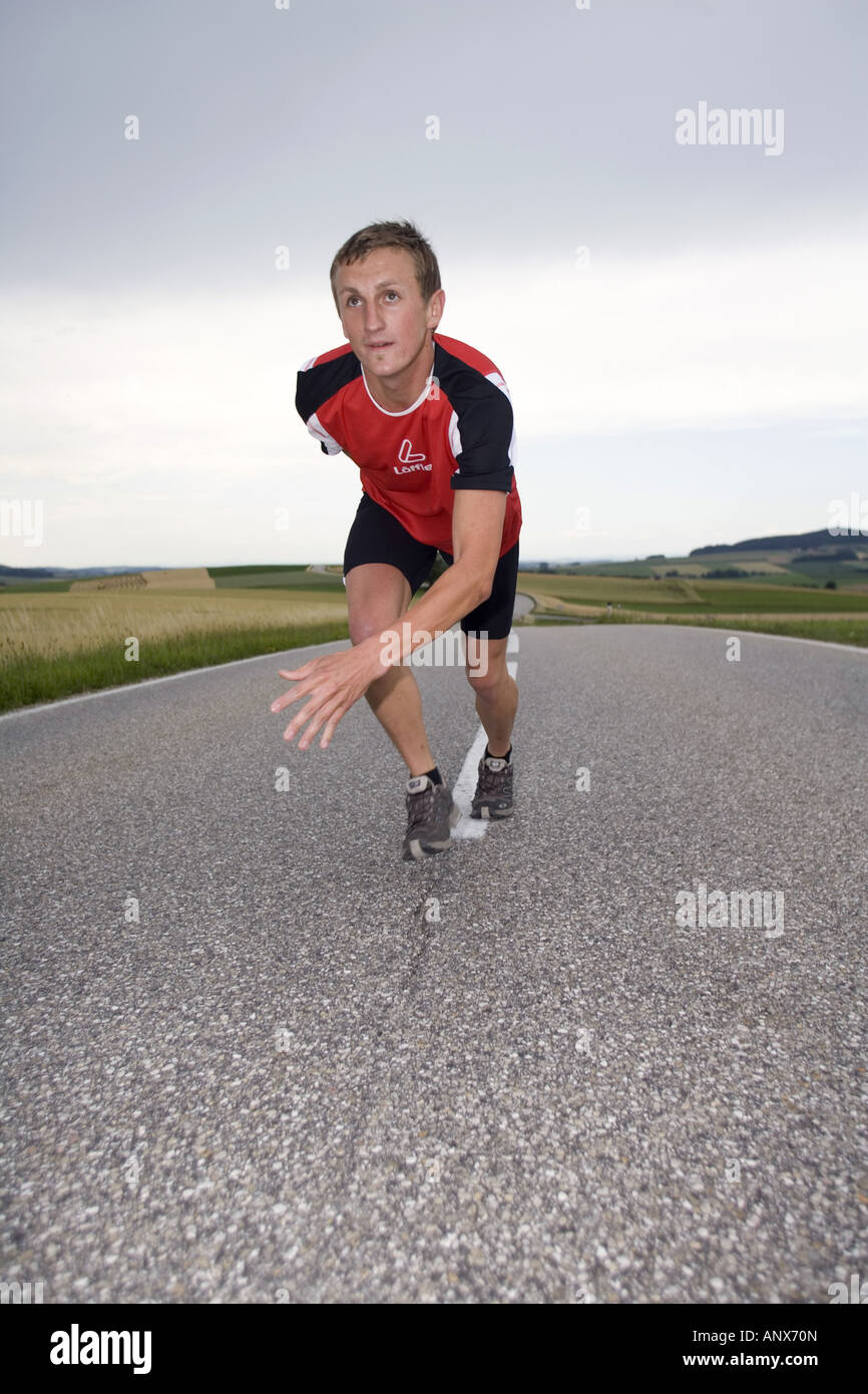 sprinter starting on road, Austria Stock Photo - Alamy