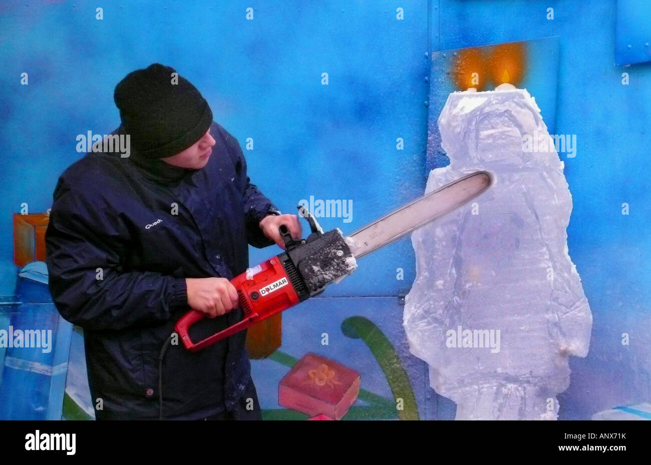 artist modelizing an ice block with a chain saw Stock Photo - Alamy