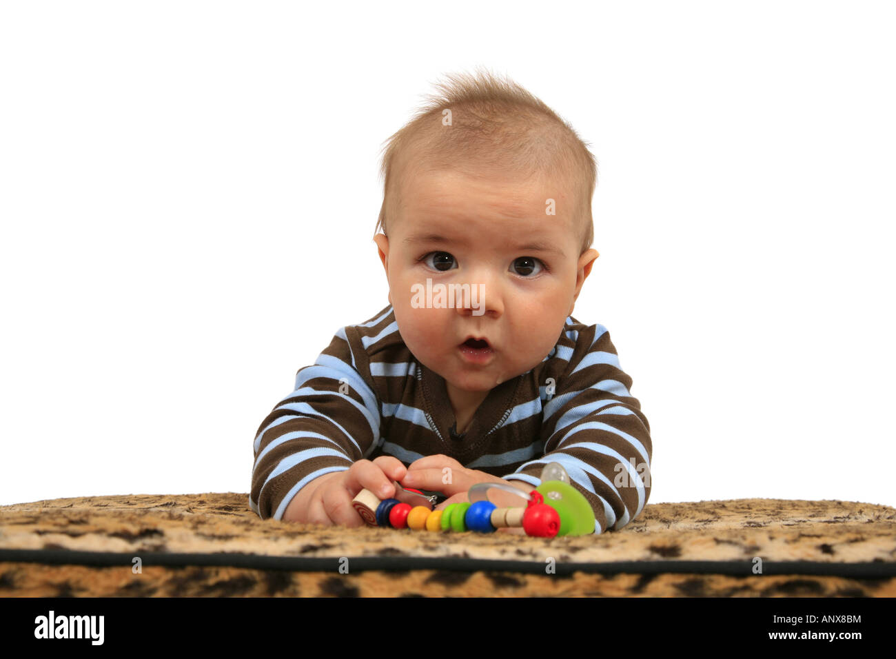 portrait of a baby with dummy and toy Stock Photo - Alamy